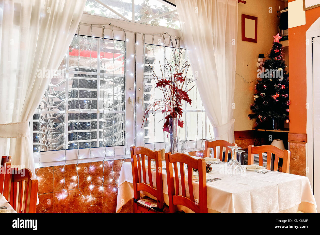Restaurant interior with Christmas decorations Stock Photo - Alamy