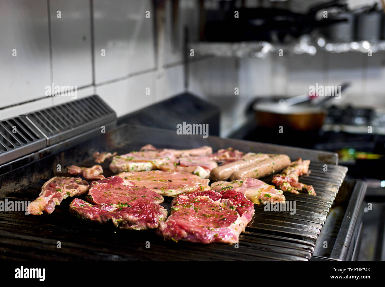 Assorted of a raw meat on the barbecue grill Stock Photo - Alamy