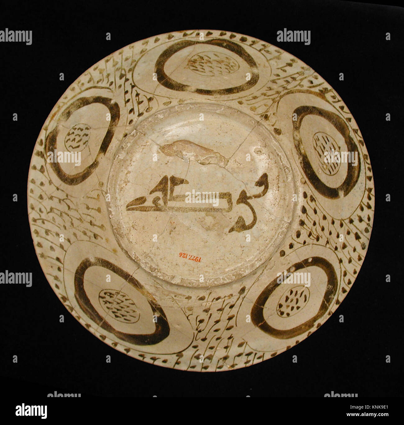 Earthenware Bowl depicting a Man holding a Cup and a Flowering Branch ...