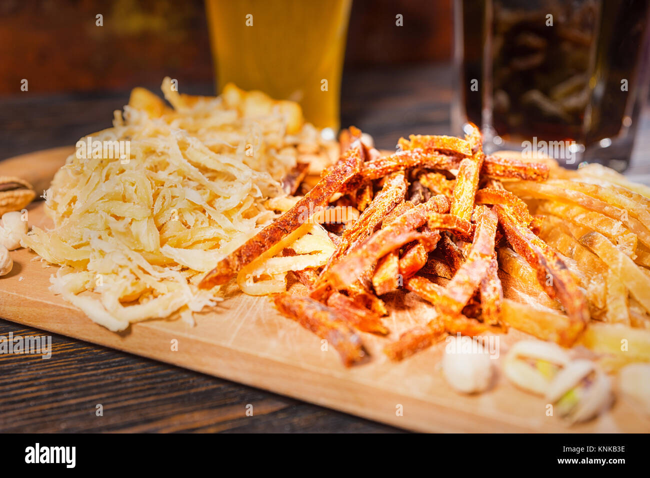 Close up of a lot of different dried fish and squid as beer snacks on ...
