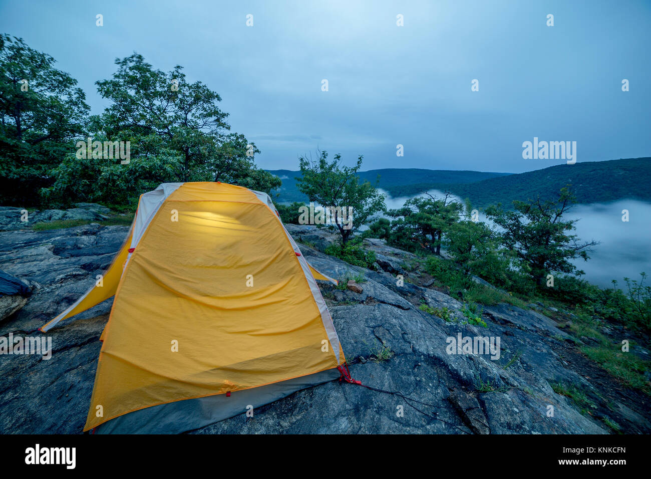 A tent on a rock ledge of Anthony's Nose in the Hudson Highlands of New ...