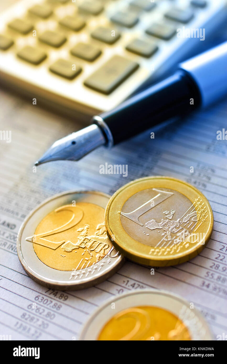Finance and economy, foreign currency coins on the business newspaper ...