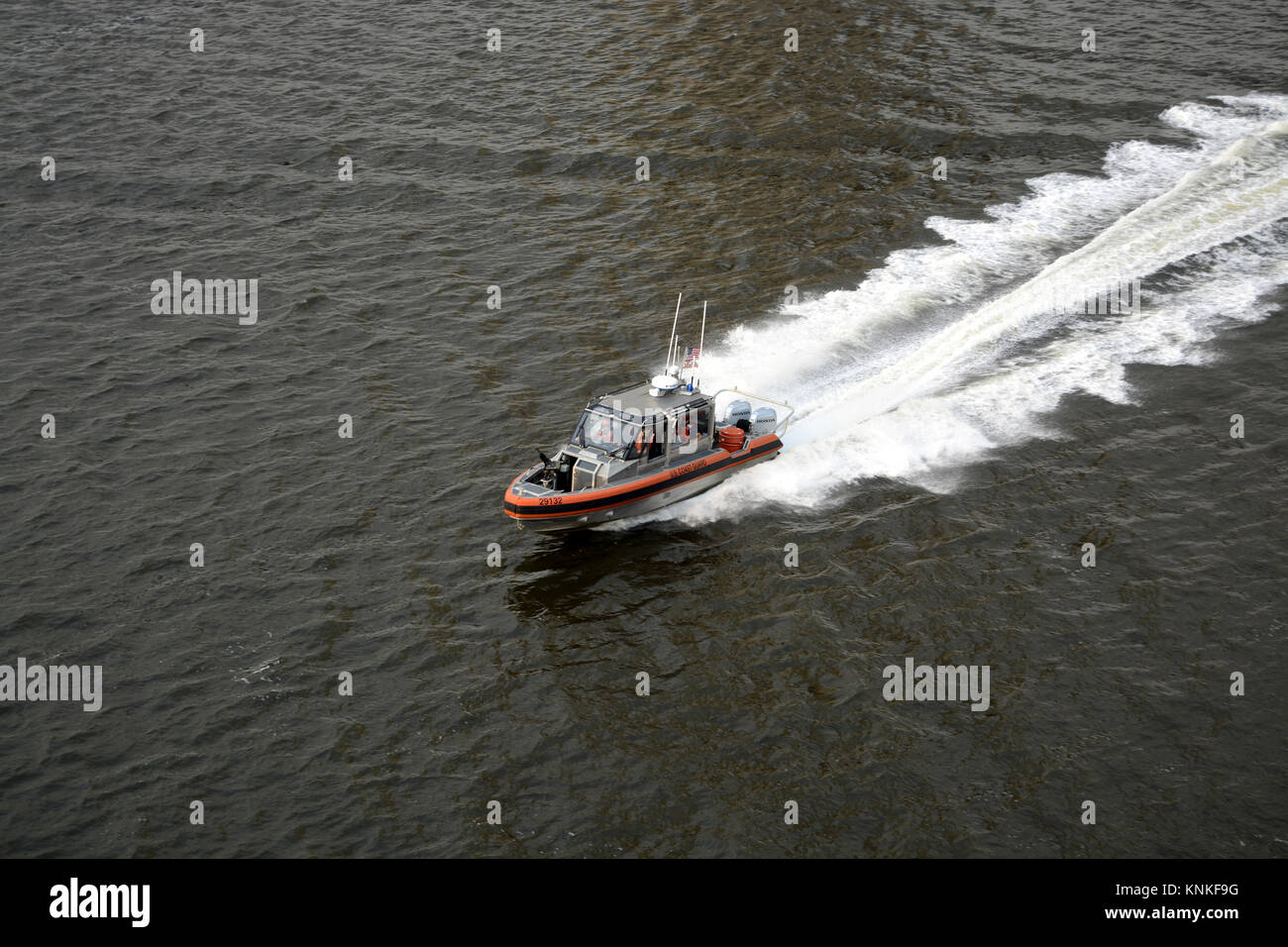 Law enforcement boat speeding along side the ship Stock Photo - Alamy