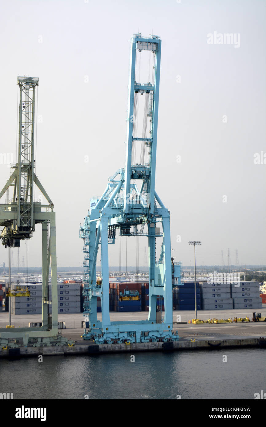 Cargo ship cranes ready to work Stock Photo - Alamy