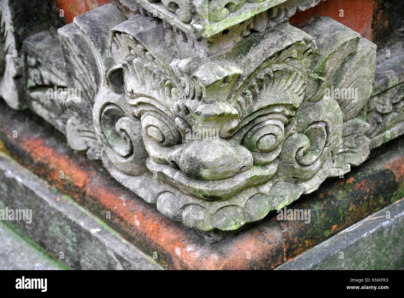 Carved face of a face in stone Stock Photo - Alamy