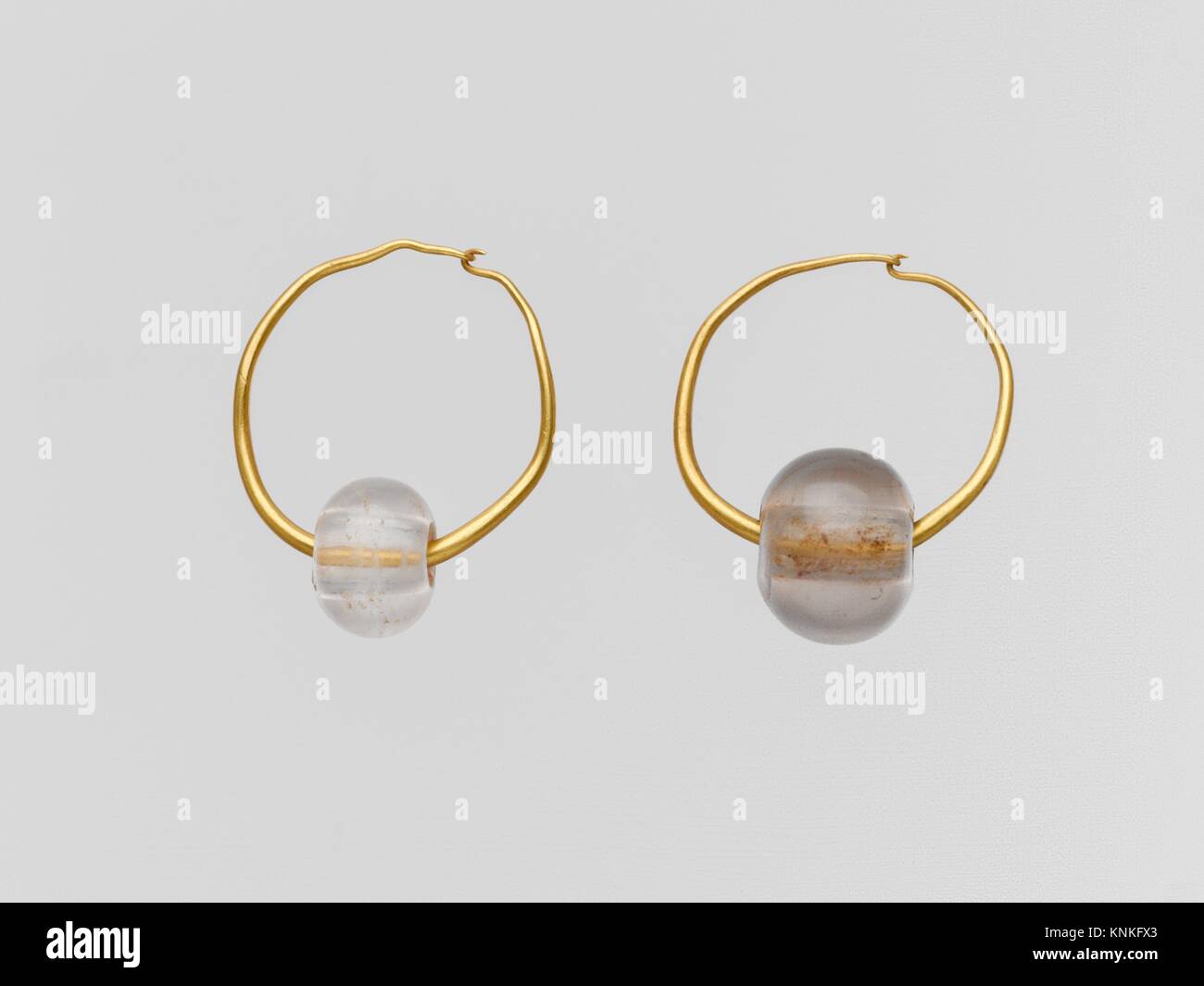 Gold earring with rock crystal bead. Period: Imperial; Date: 1st-2nd ...