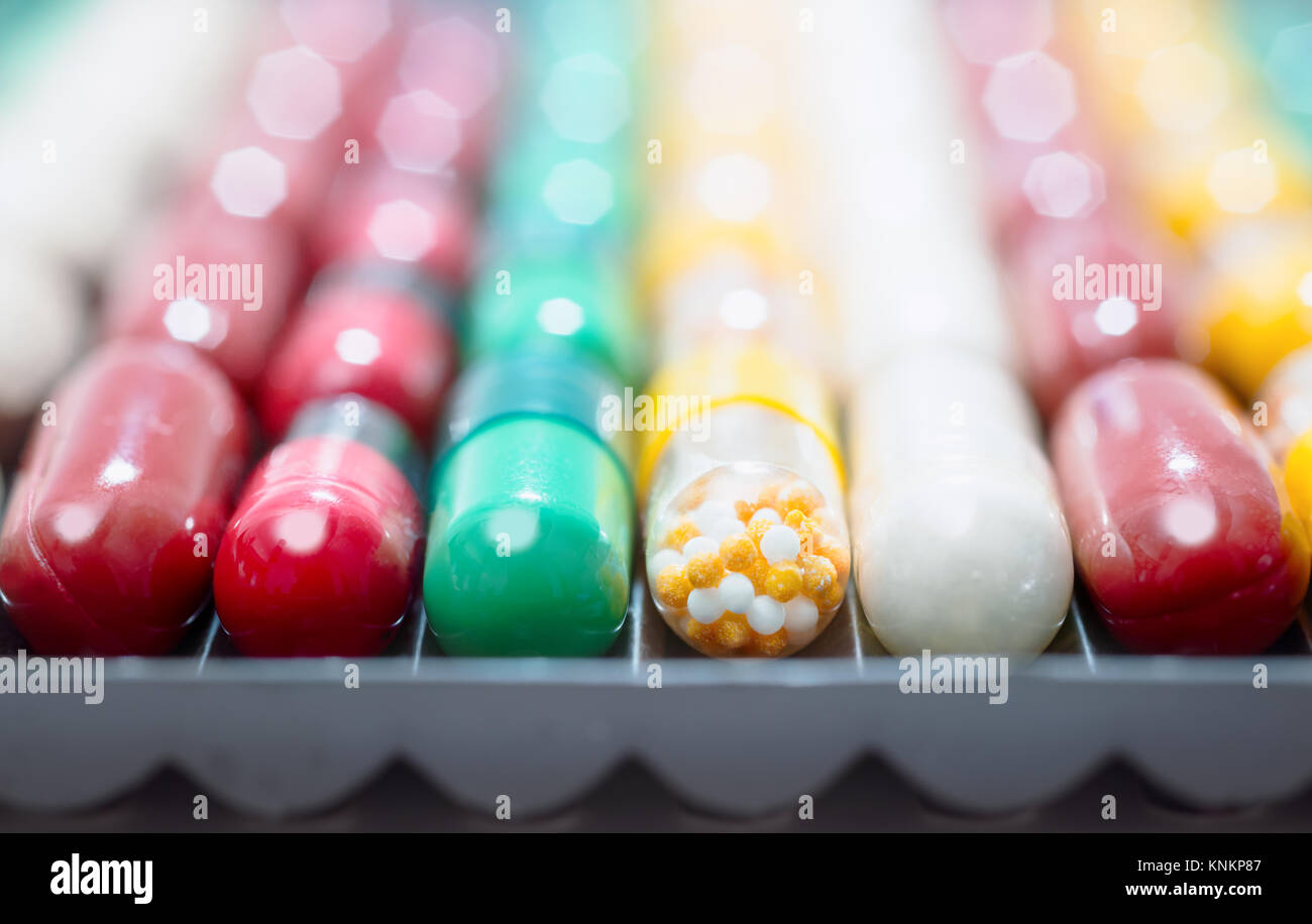 Closeup on different capsules on display Stock Photo - Alamy