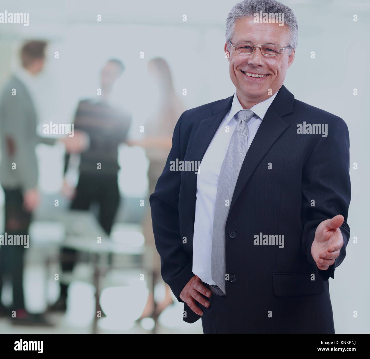Portrait of a successful businessman giving a hand Stock Photo - Alamy
