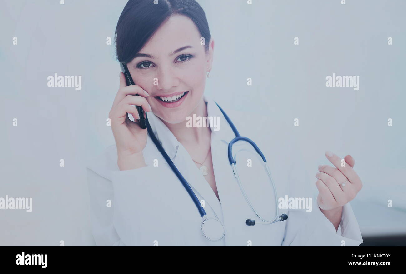 Doctor talking on telephone Stock Photo - Alamy