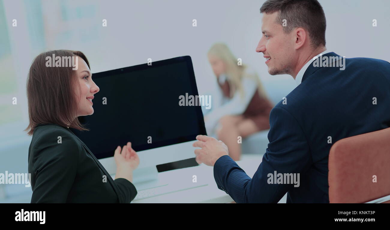 Portrait of smart business partners using computer at meeting Stock ...