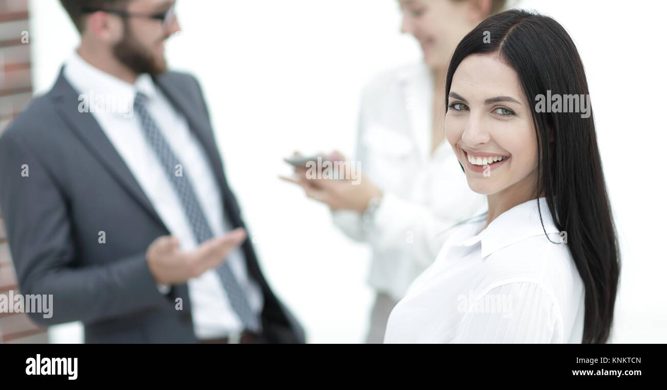 close-up of a beautiful woman manager and co-workers in the office ...