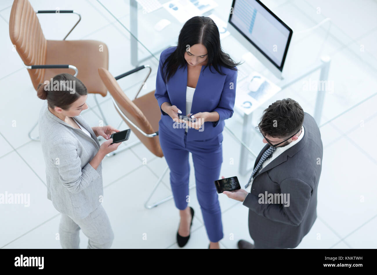 View from above of happy young partners in the office Stock Photo - Alamy