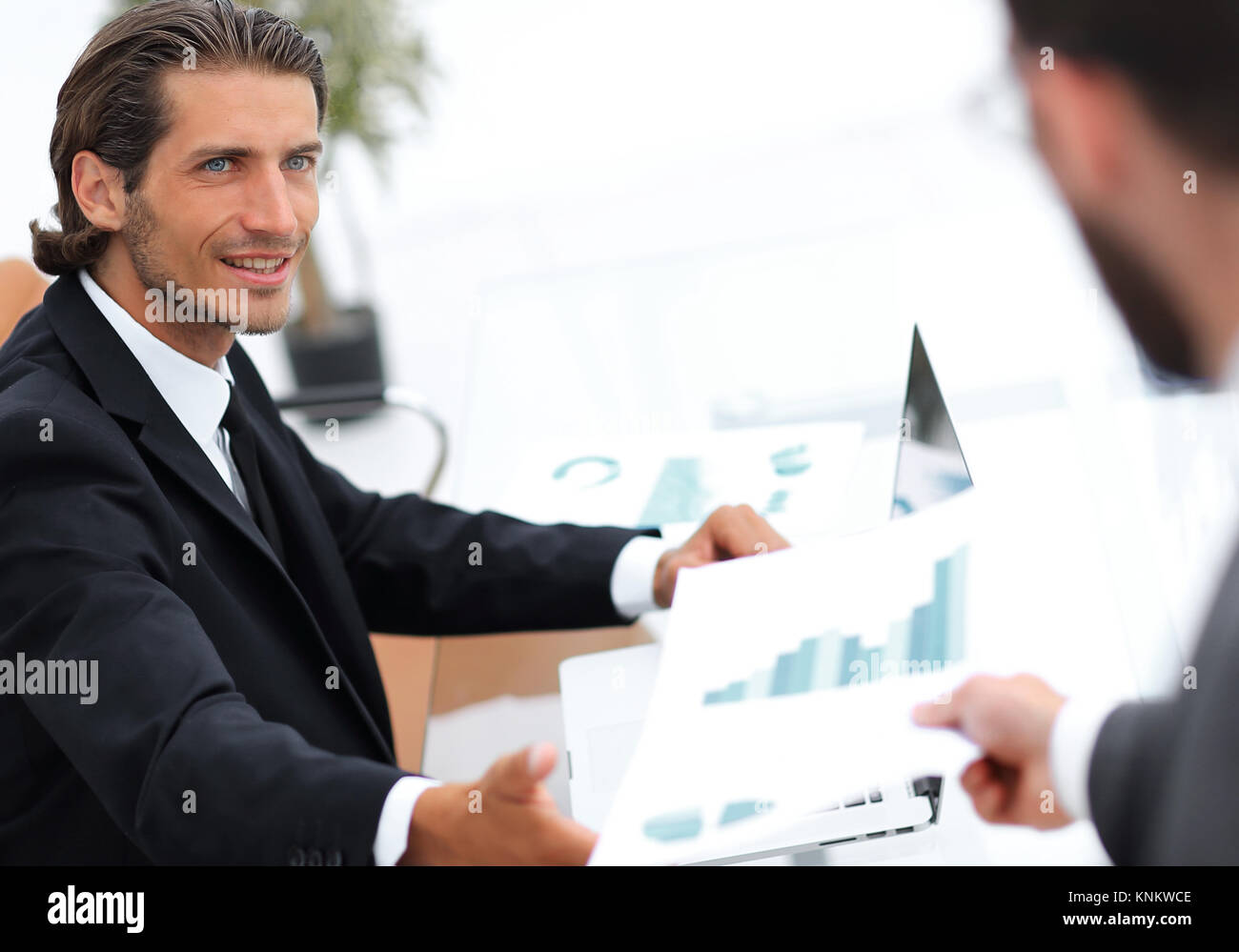 employee gives the Manager the financial report Stock Photo - Alamy