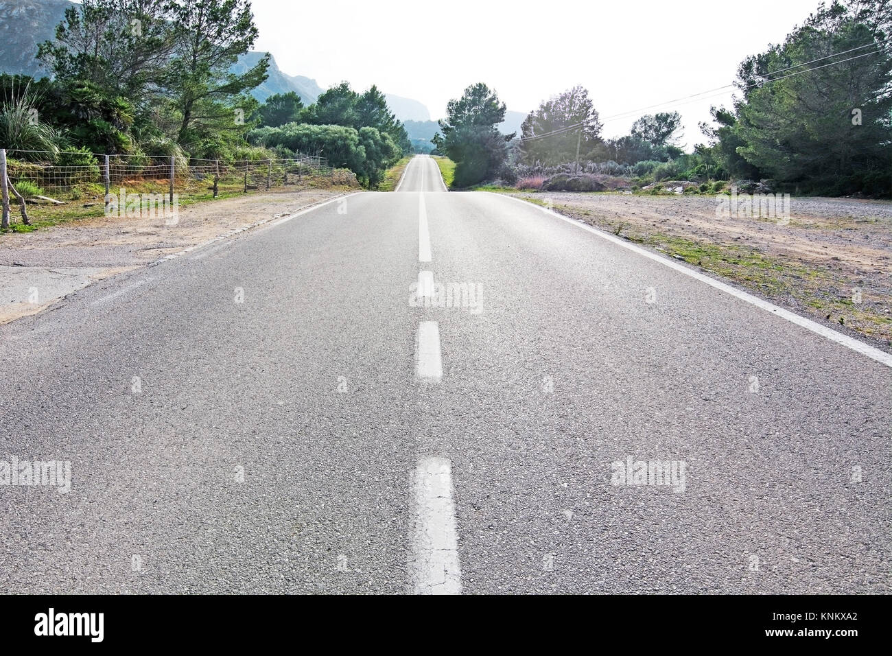 Straight asphalted country road over hills through Mediterranean ...