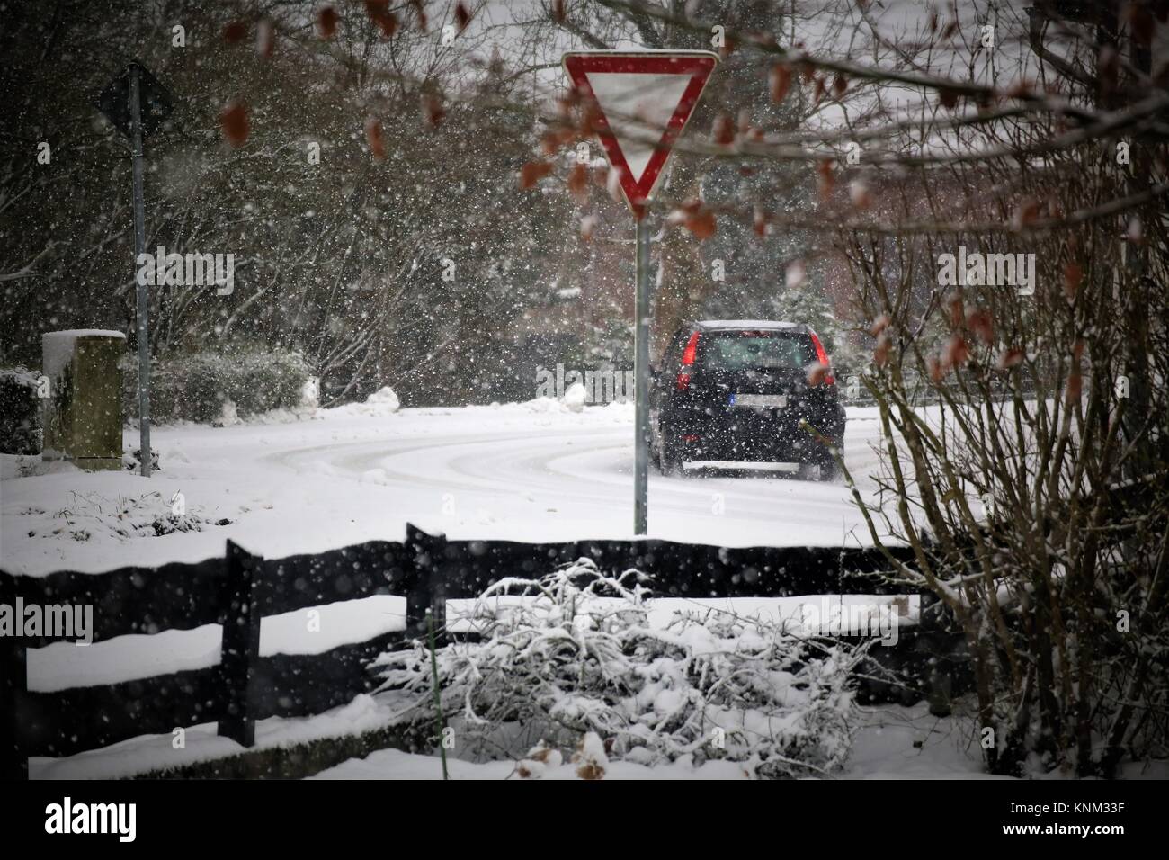 An Image of a road in winter with snow and a traffic sign Stock Photo ...