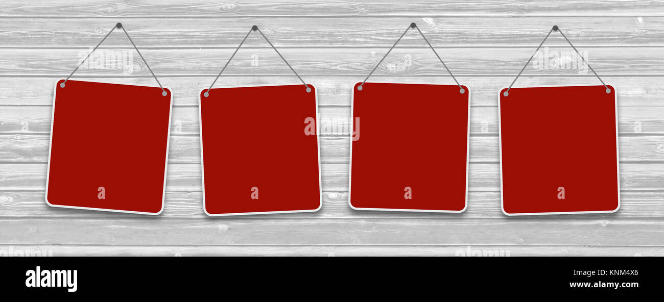 Four red hanging signs for text on a wooden white background Stock ...