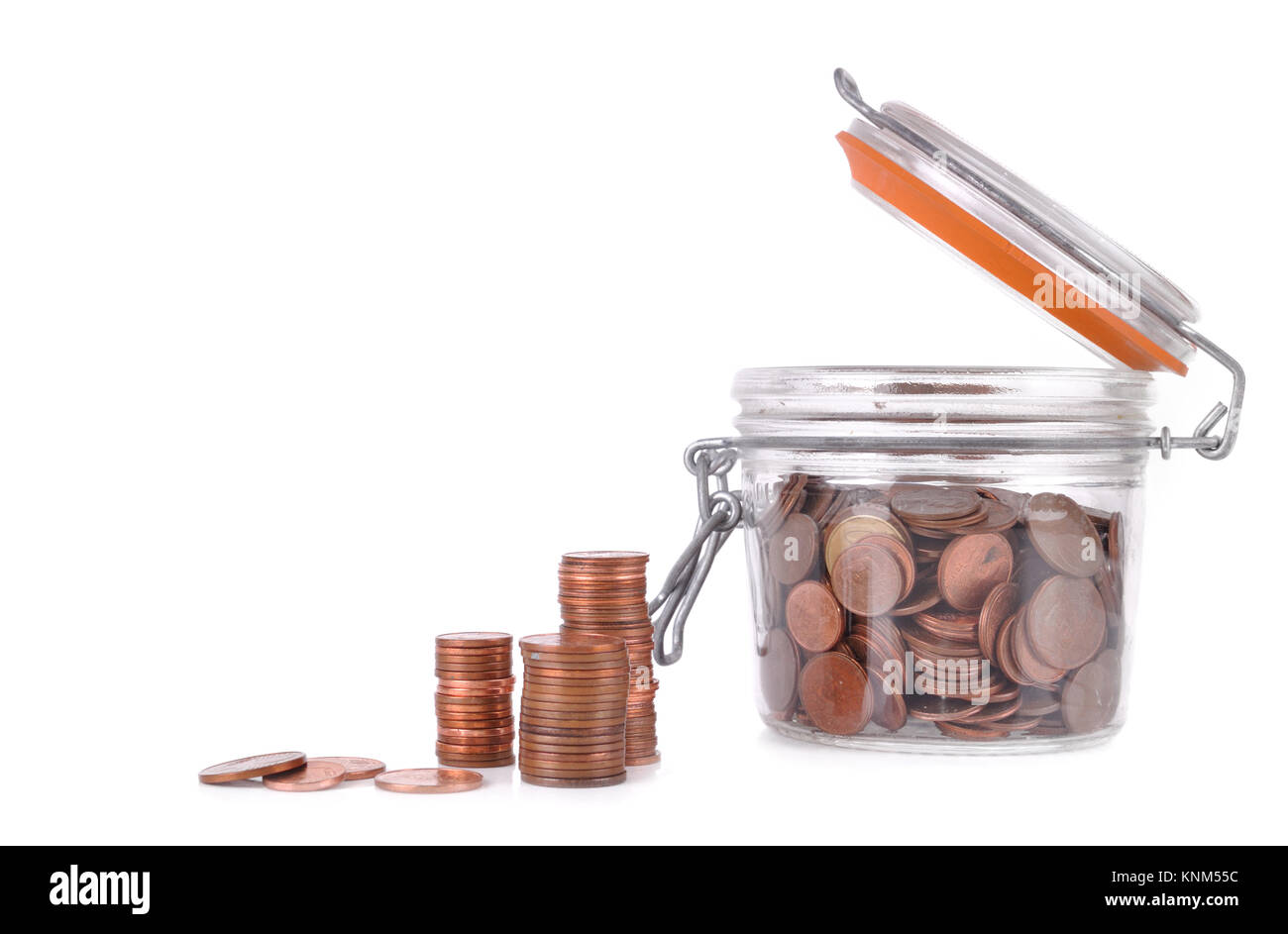 stack of coins and jar full of coins on white background Stock Photo ...