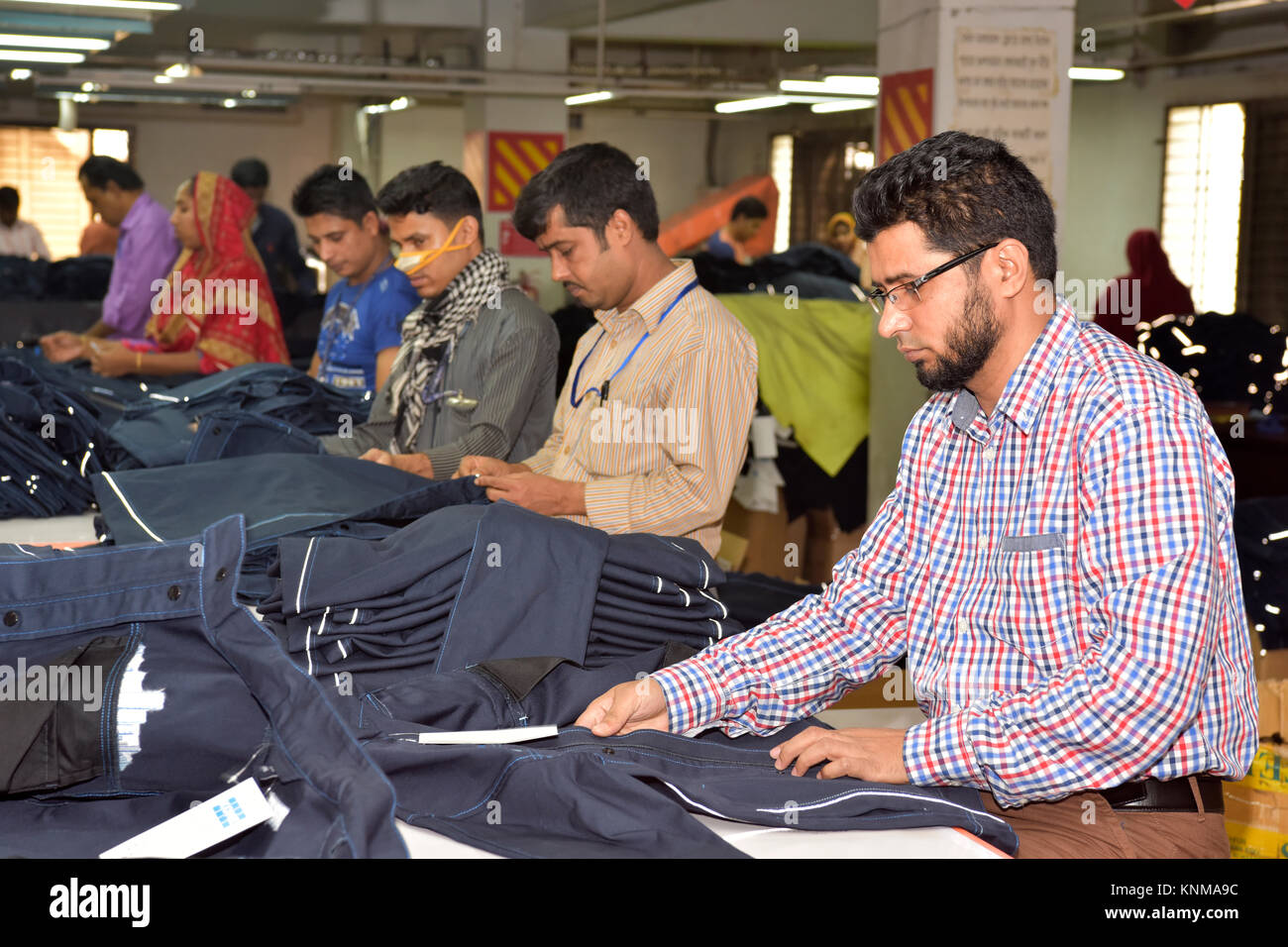 DHAKA, BANGLADESH - DECEMBER 26, 2016: Bangladeshi garments workers ...