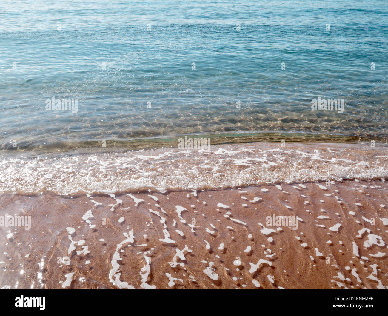 Sandy beach and sea water Stock Photo - Alamy