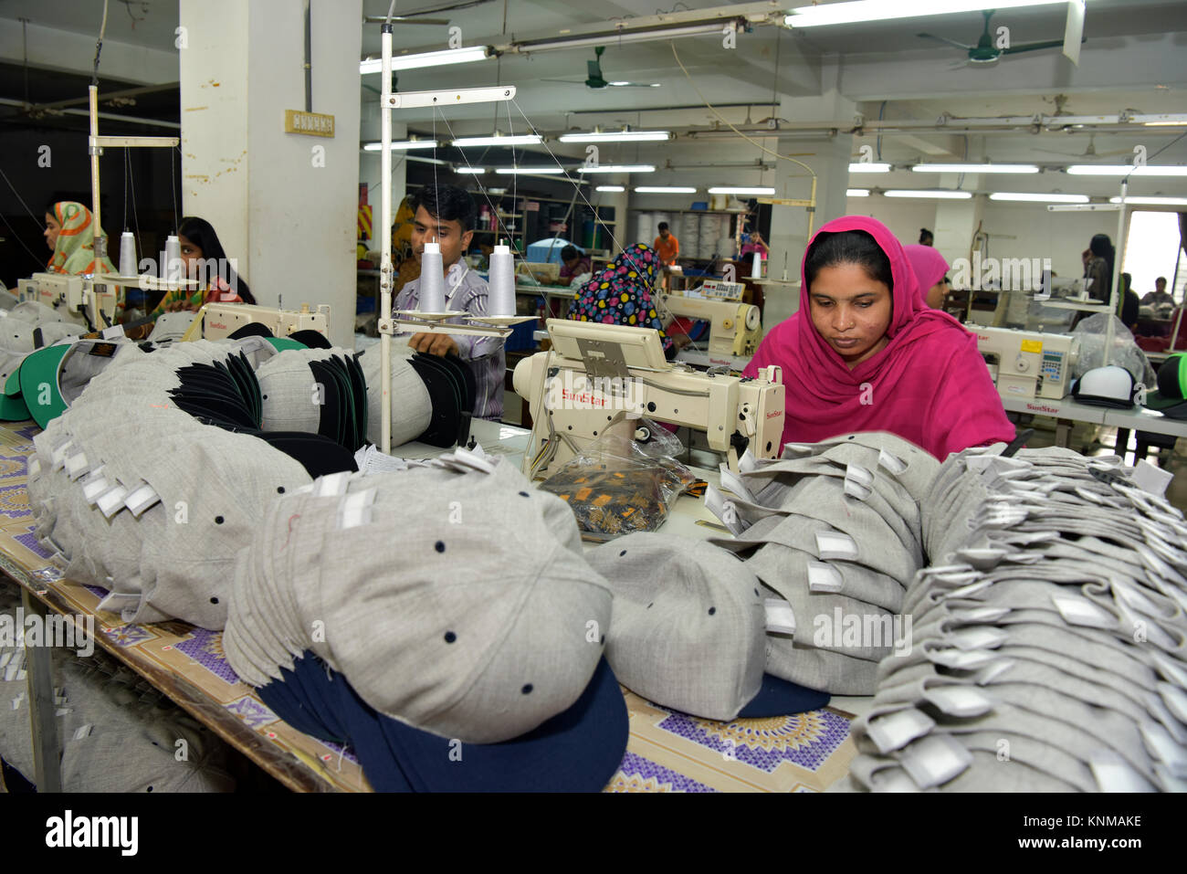 DHAKA, BANGLADESH - DECEMBER 26, 2016: Bangladeshi garments workers ...