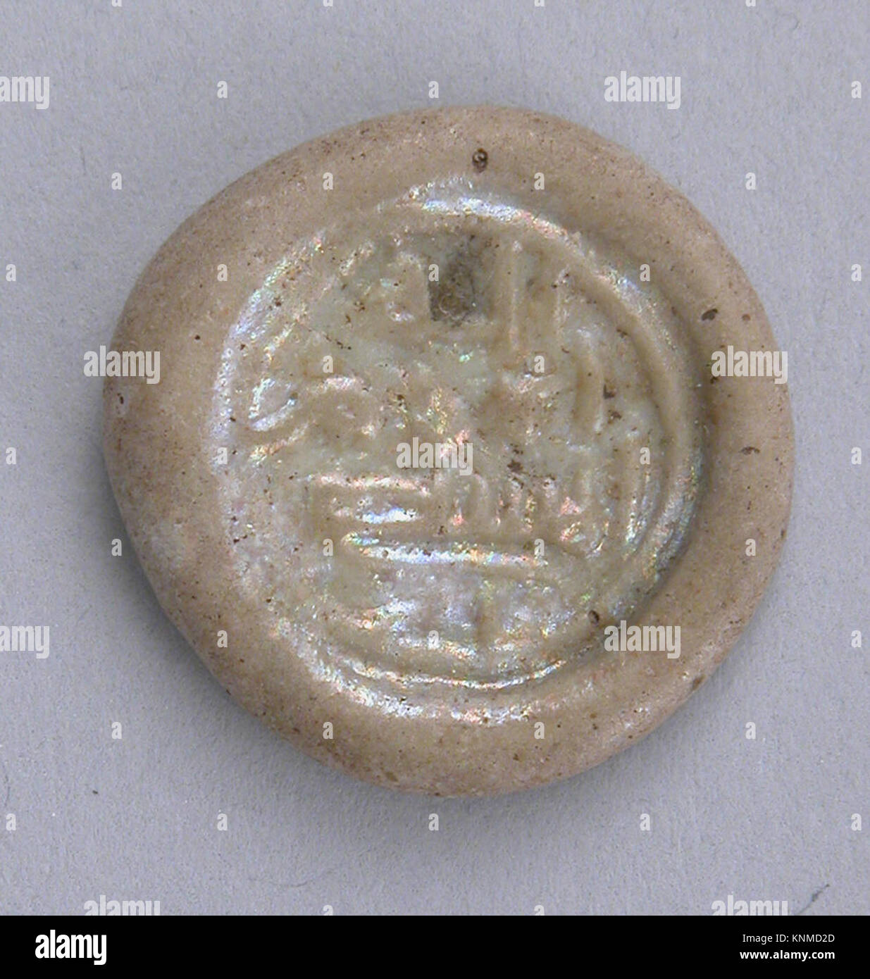 A 12th-century Egyptian coin weight made of glass, used to measure ...