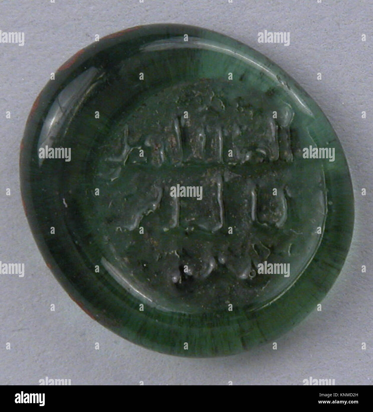 An 11th century Egyptian glass coin weight used in trade and currency ...