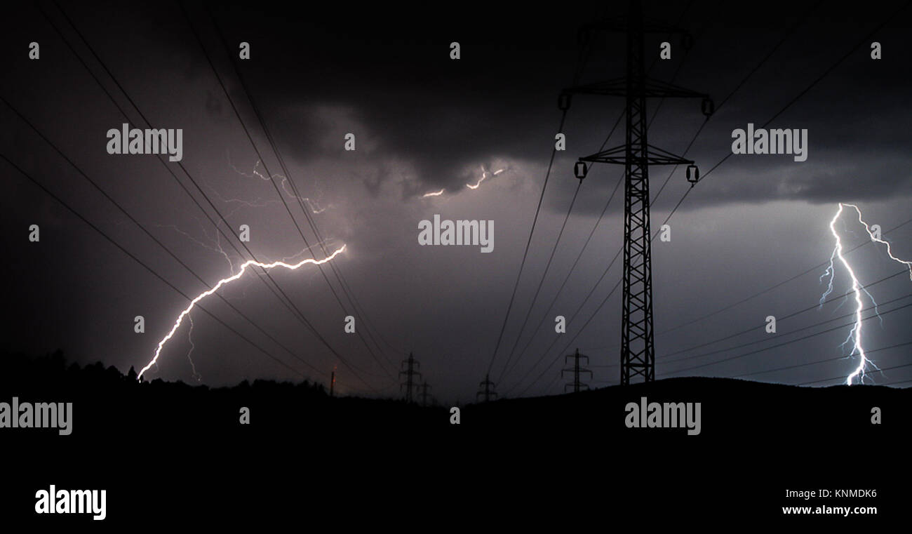 The lightning strikes the high voltage line in a storm Stock Photo - Alamy