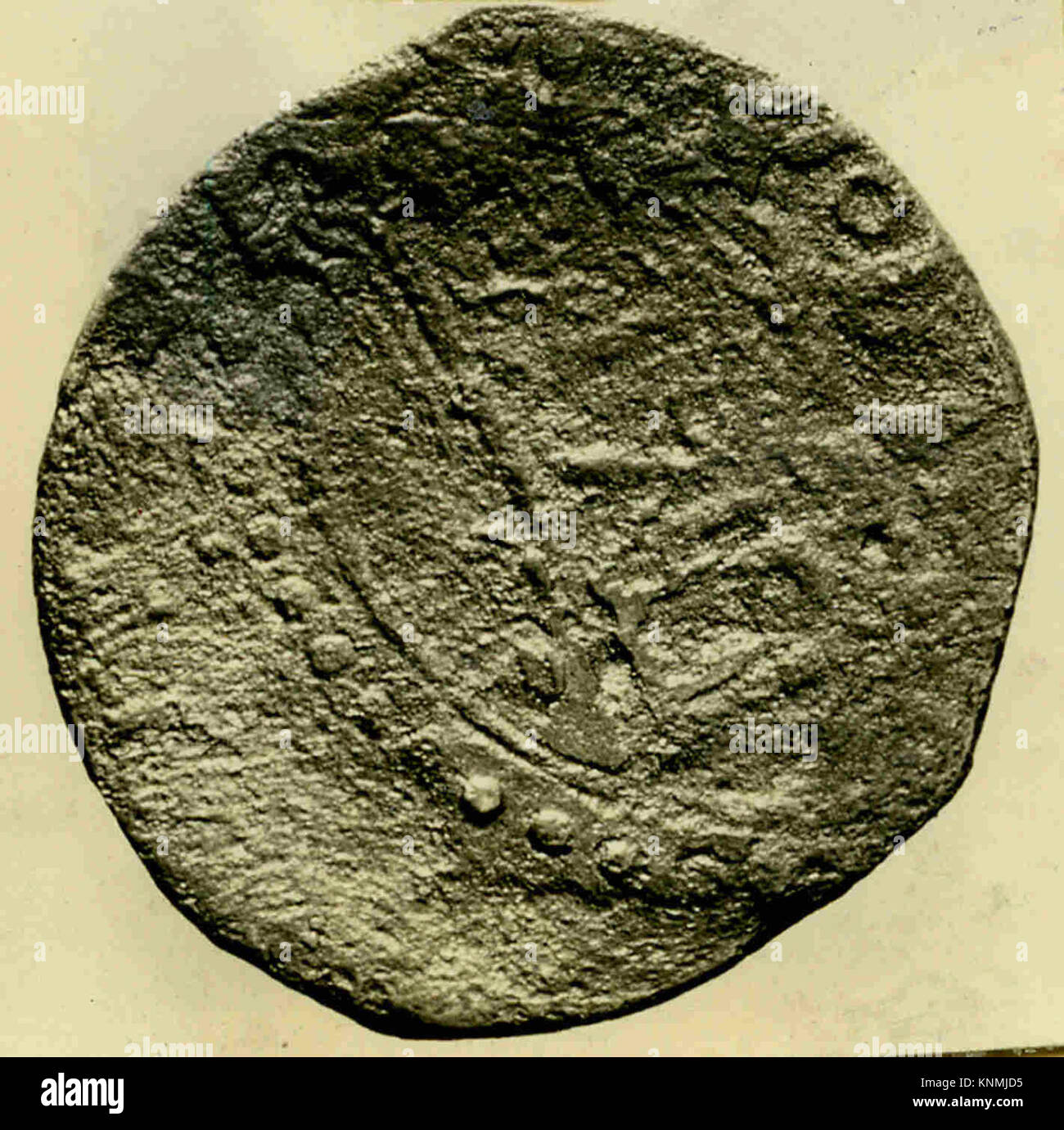 Ancient coin featuring inscriptions and imagery on metal, used ...