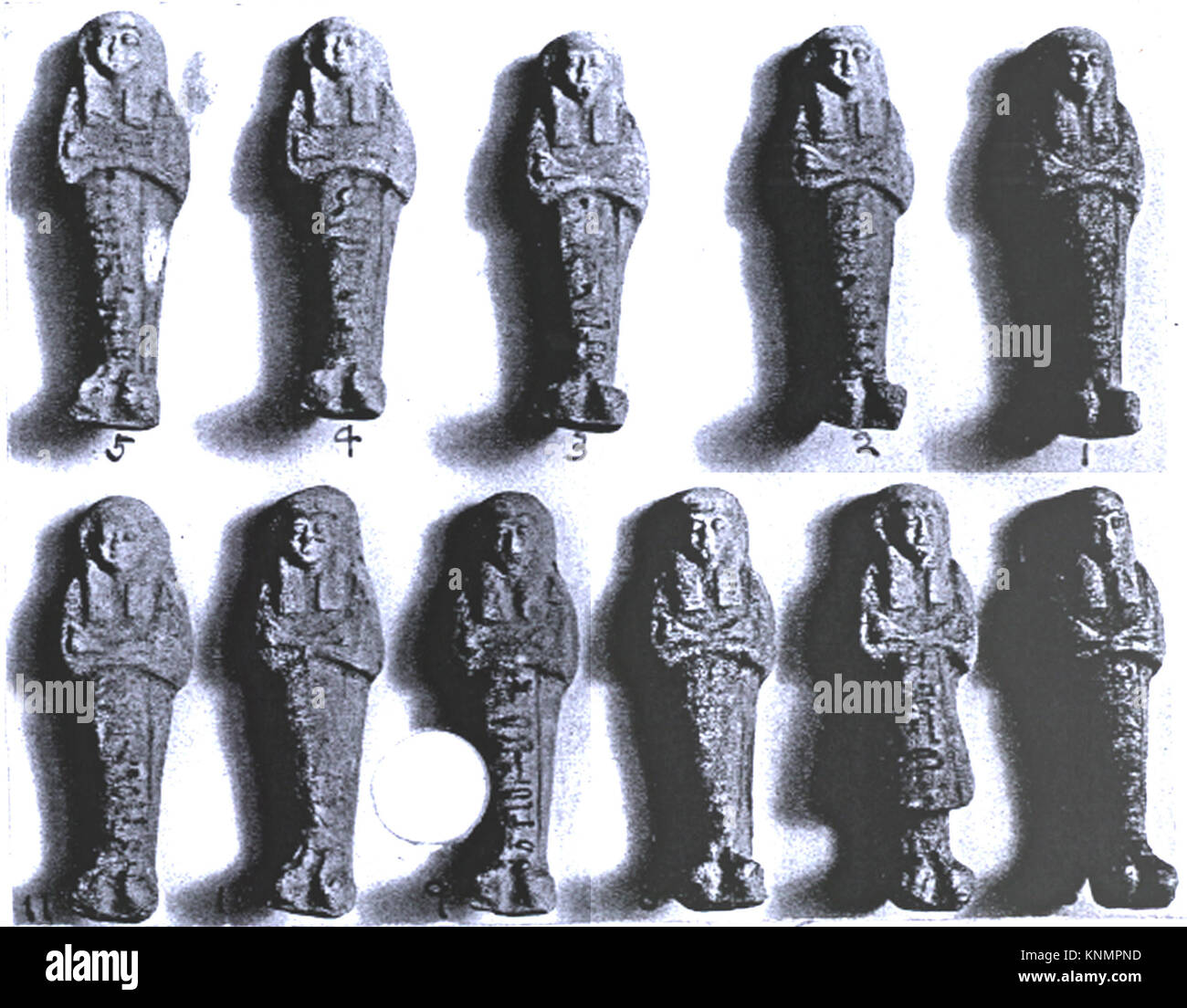 Eleven painted shabti figurines housed in a jar, used in ancient ...