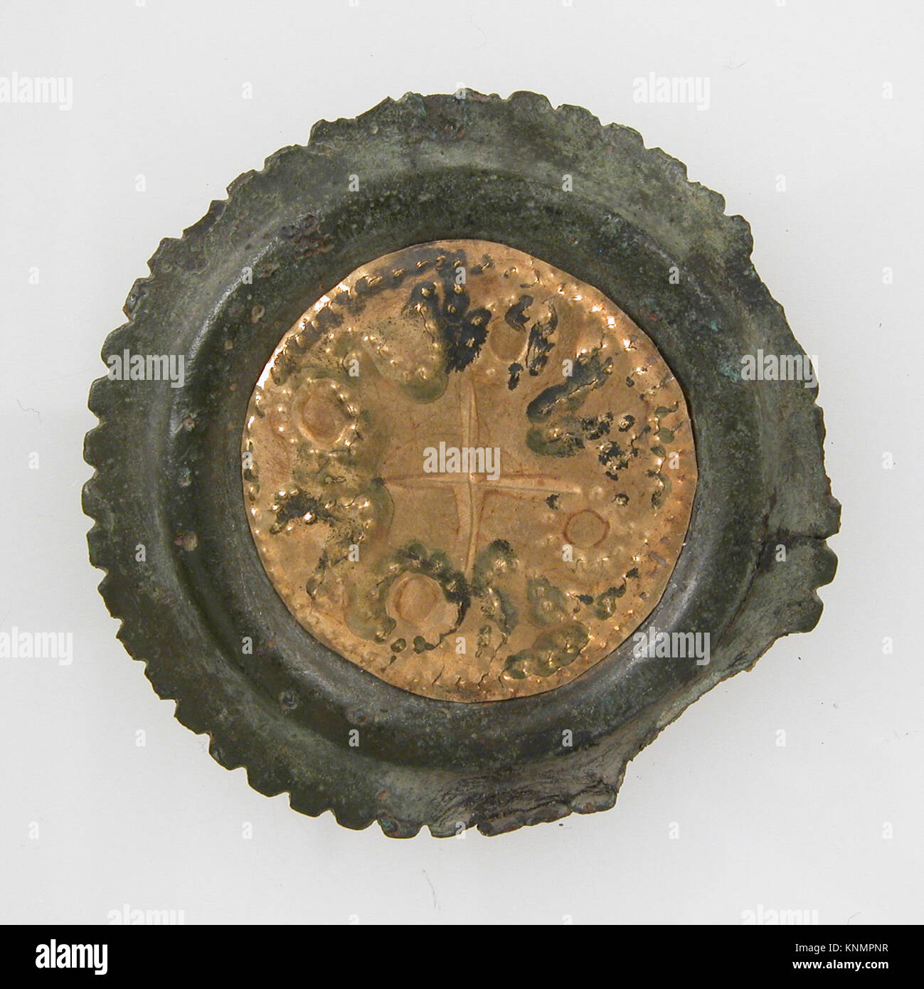 A Frankish bracteate from the 6th–7th century, made of copper alloy and ...