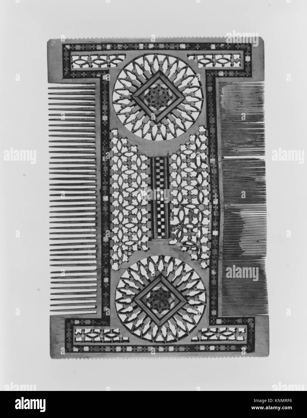 A comb made from an organic or bone material, exhibiting fine ...