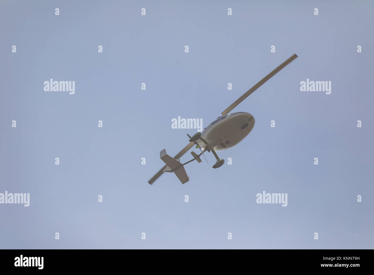 white gyroplane in sky, Ultralight gyroplane Stock Photo - Alamy