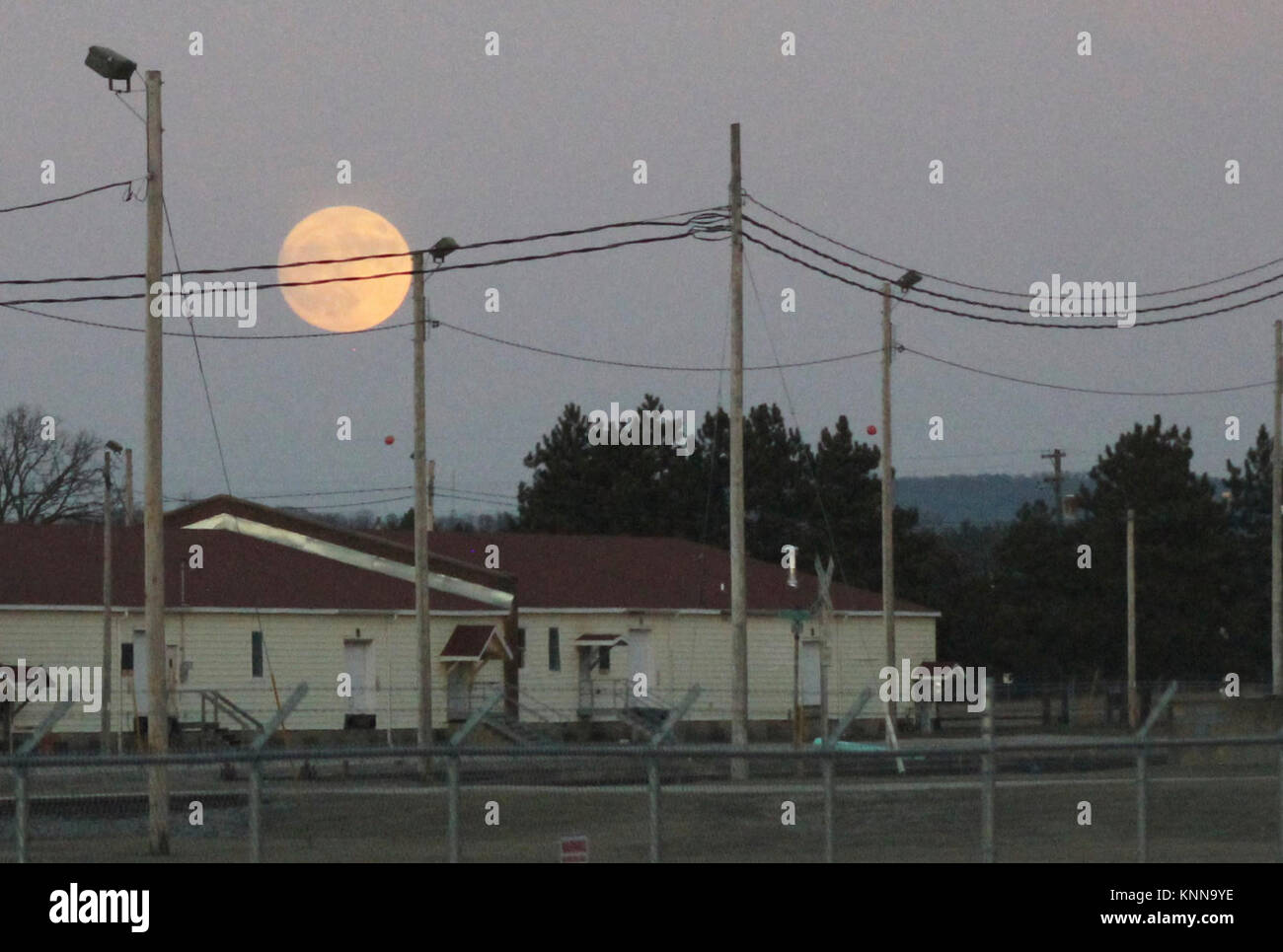 A full moon, called a "super moon" is shown rising over the cantonment ...