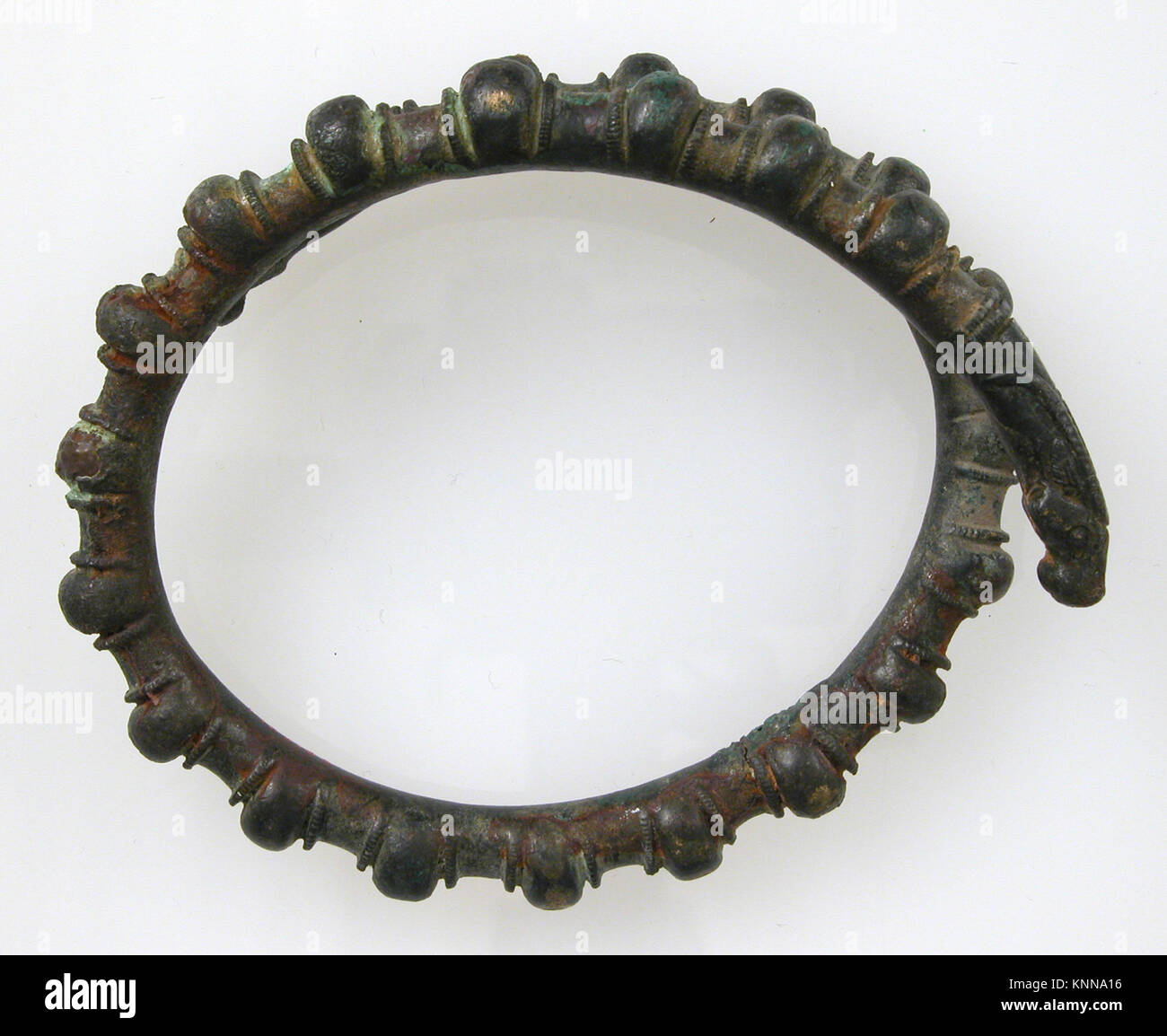 Ancient Celtic armlet in cast bronze, dating to circa 400 B.C., held by ...