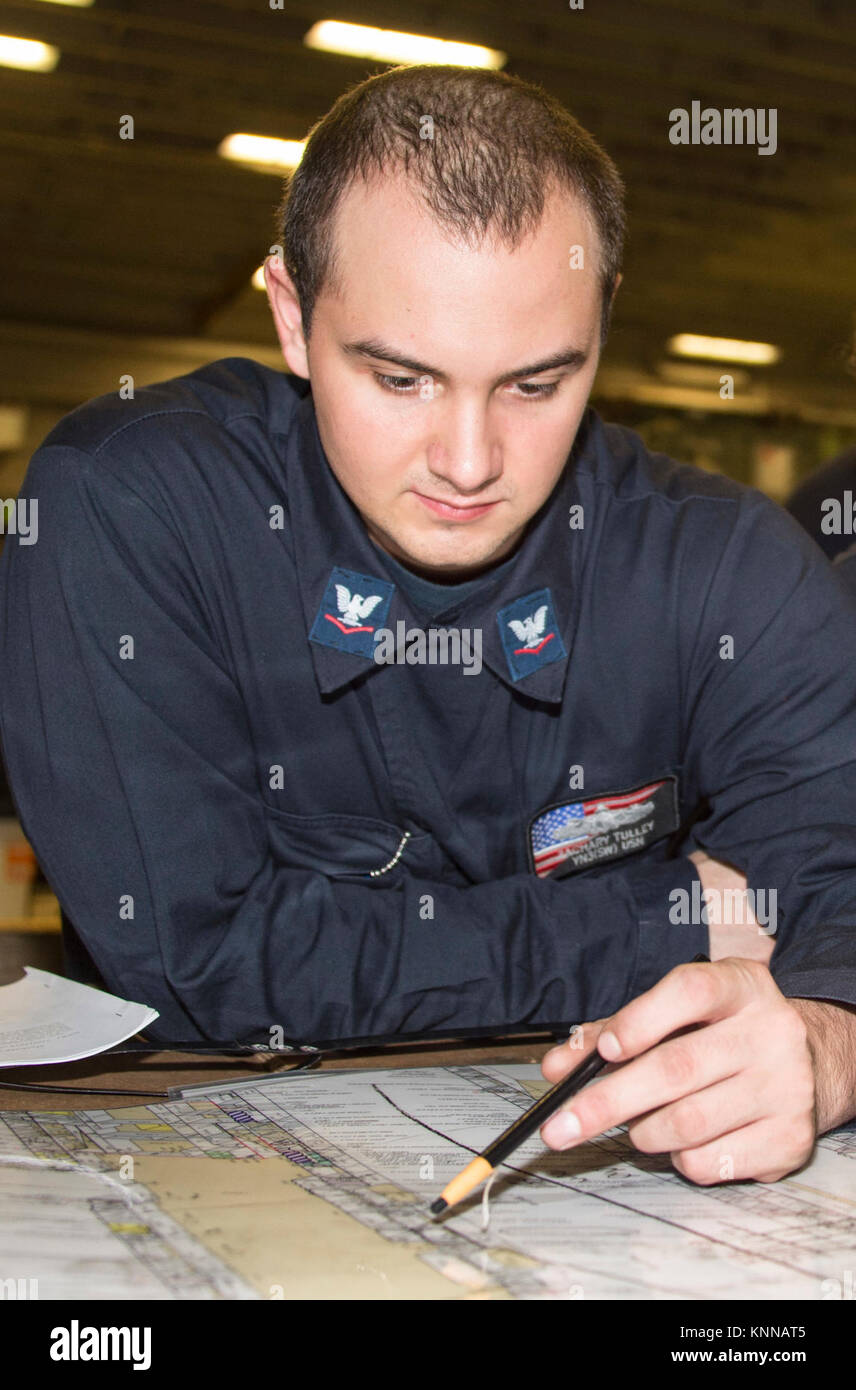 ATLANTIC OCEAN (Dec. 2, 2017) Yeoman 3rd Class Zachary Tulley plots a ...