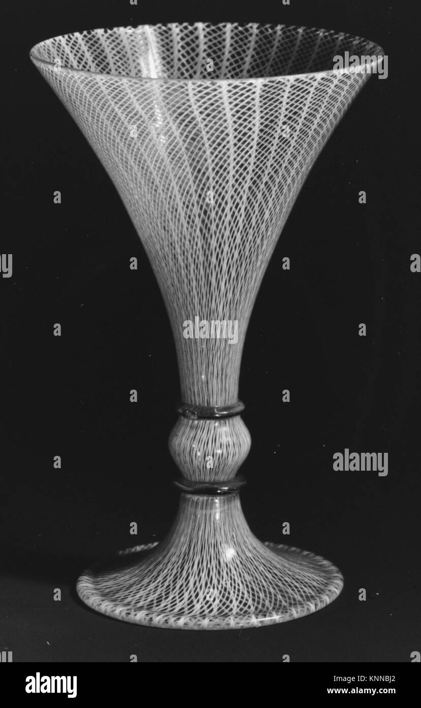 Ancient goblet made from metal, featuring a decorated body and a flared ...
