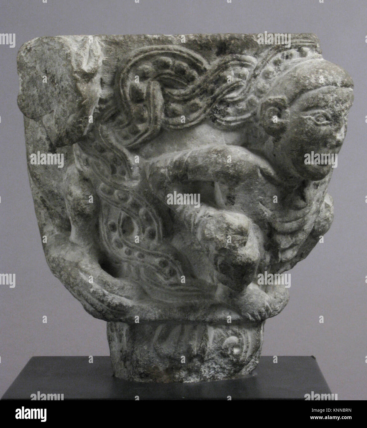 Stone architectural capital featuring carved decoration, classical ...