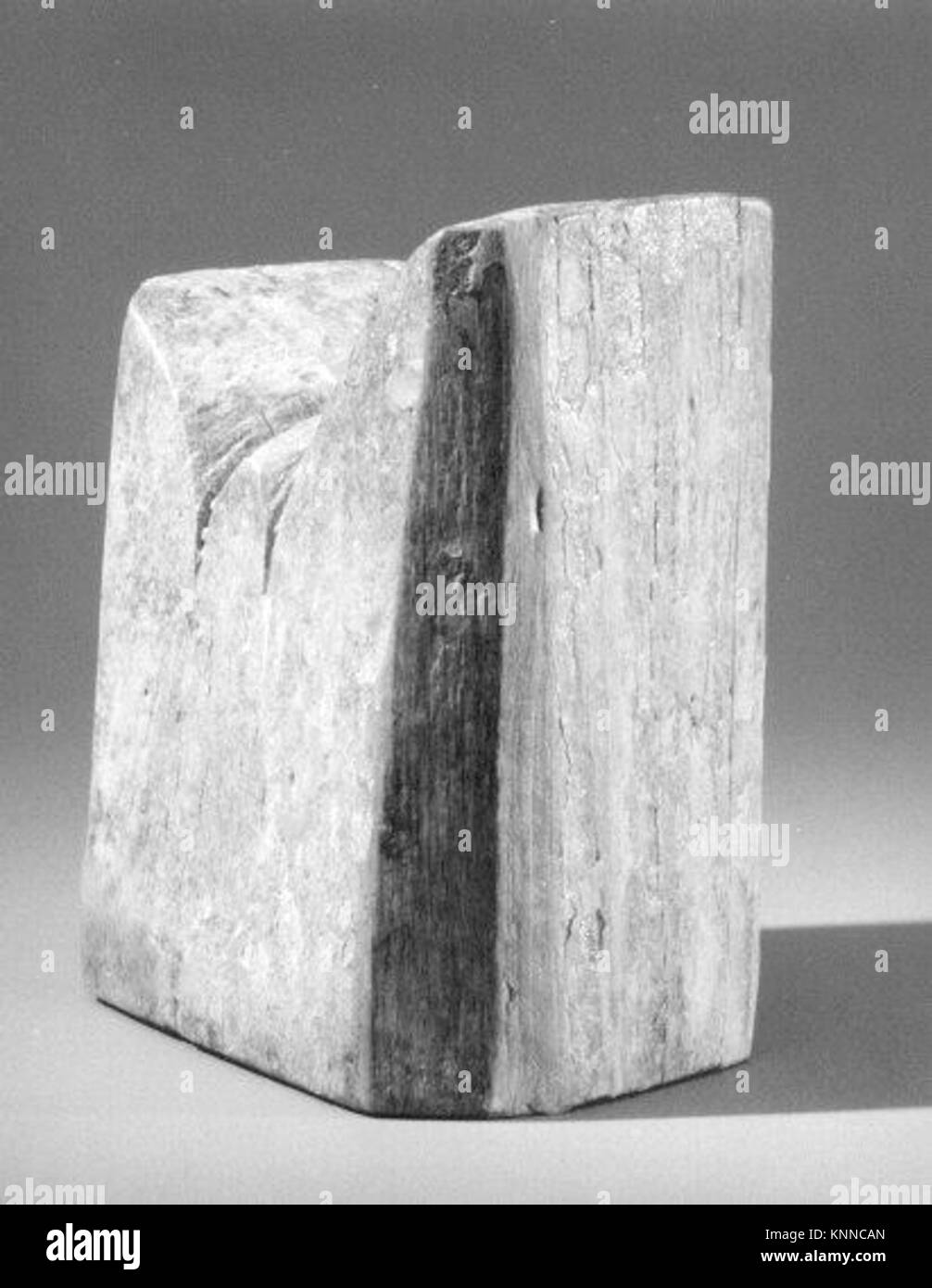 Rook chess piece carved from ivory with cylindrical body and battlement ...