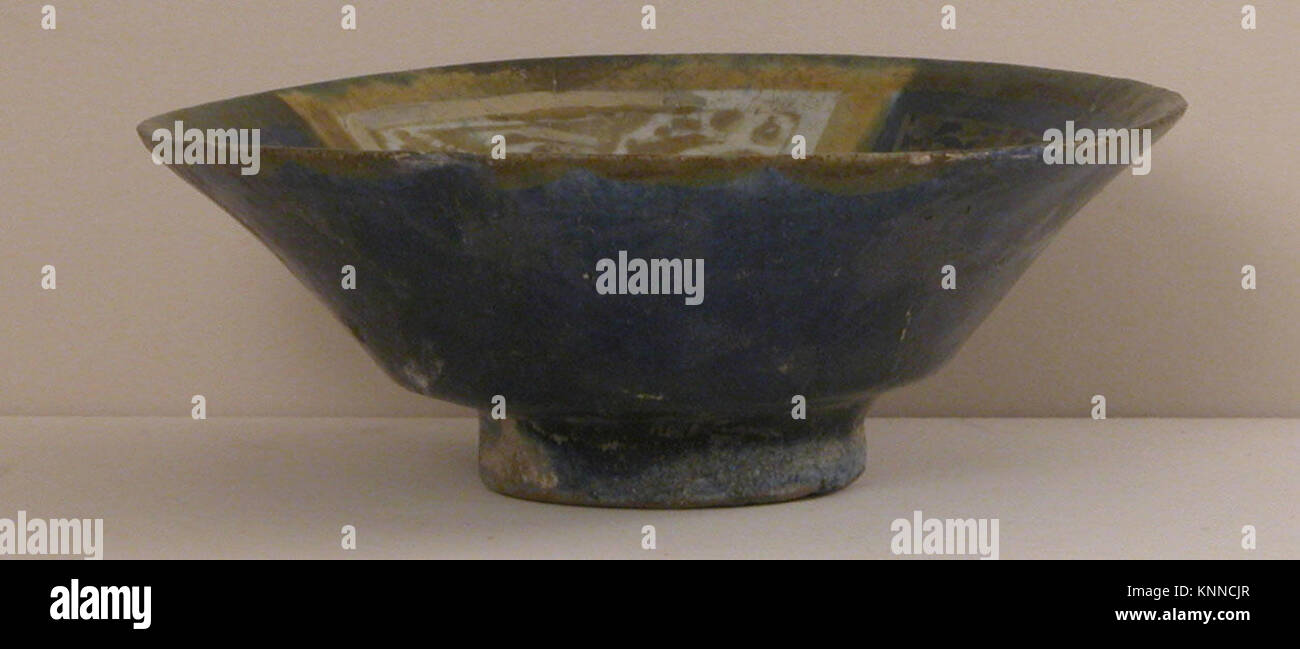 This MET bowl is a ceramic vessel with a rounded body and wide opening ...