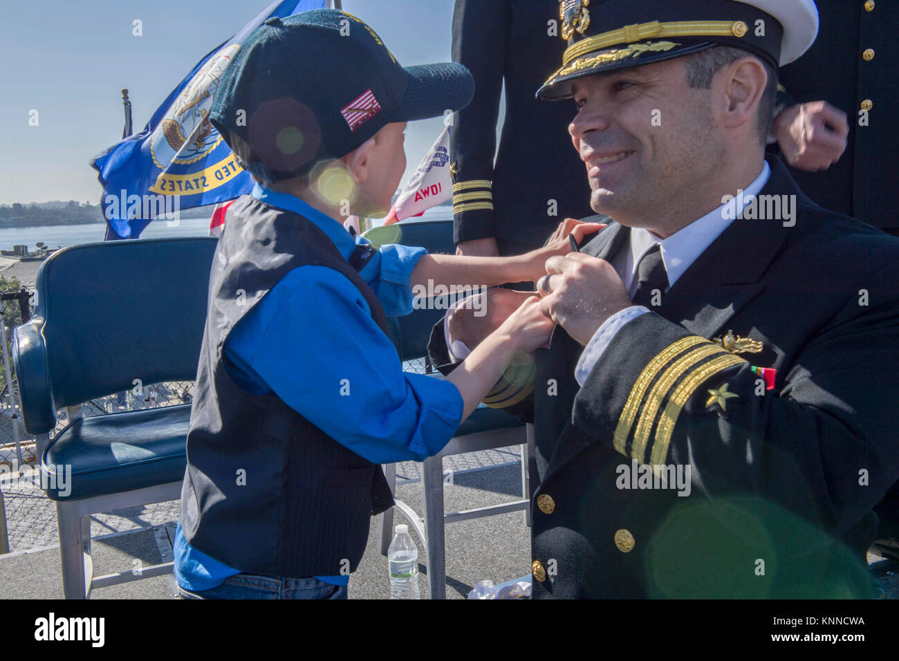 USS MIDWAY MUSEUM, Calif. (Dec 01, 2017) CDR Edward Bertucci assists ...