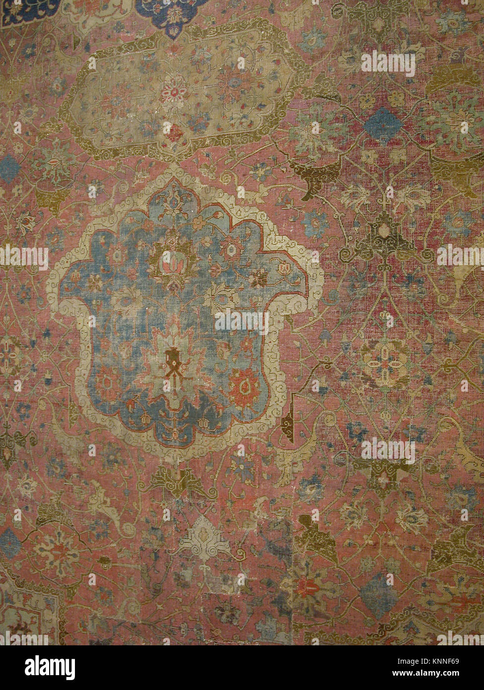 This carpet, measuring 145 x 102 inches, features a dense pattern of ...