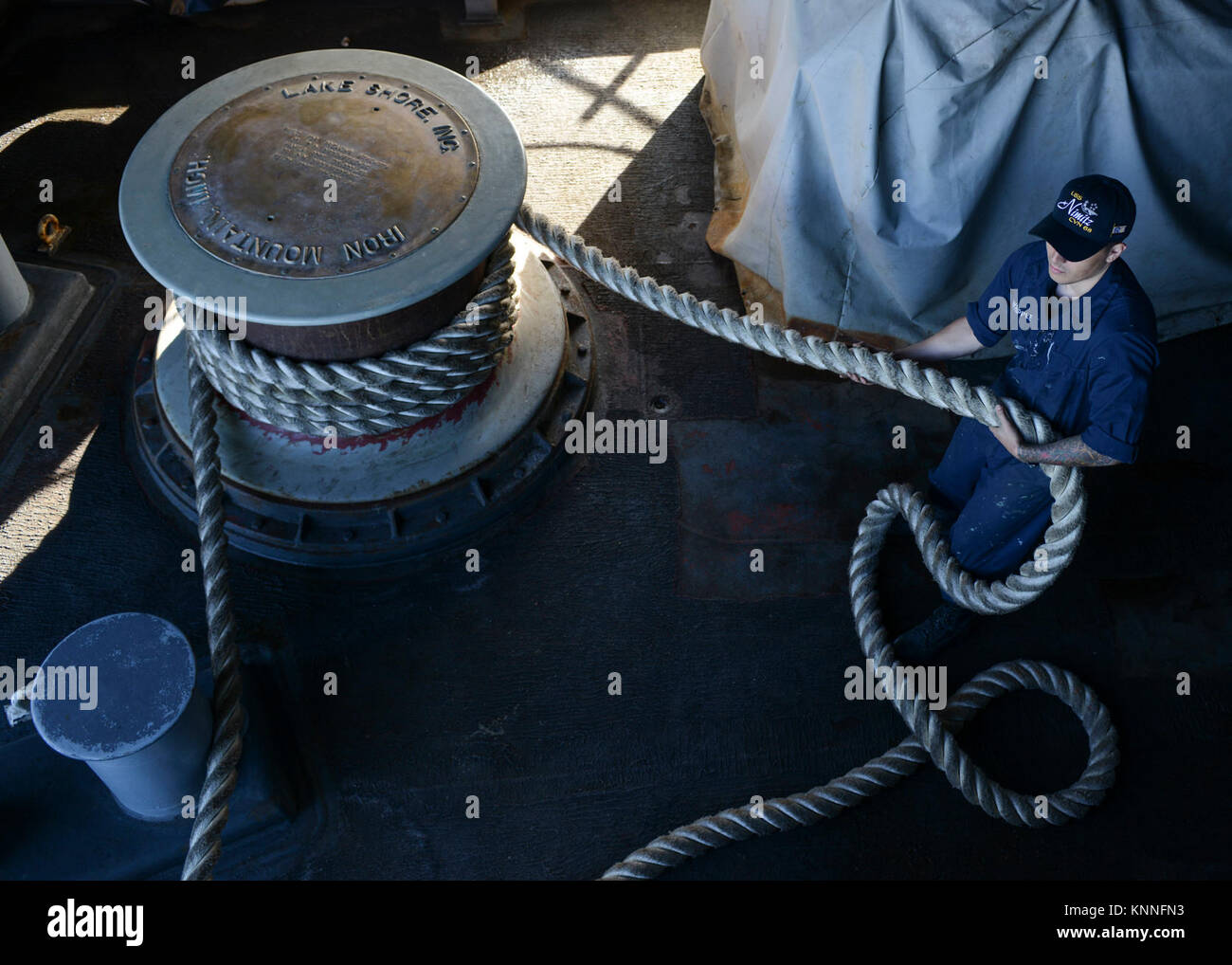 U.S. Navy Seaman Garrett Whipple, from San Antonio, handles line aboard ...