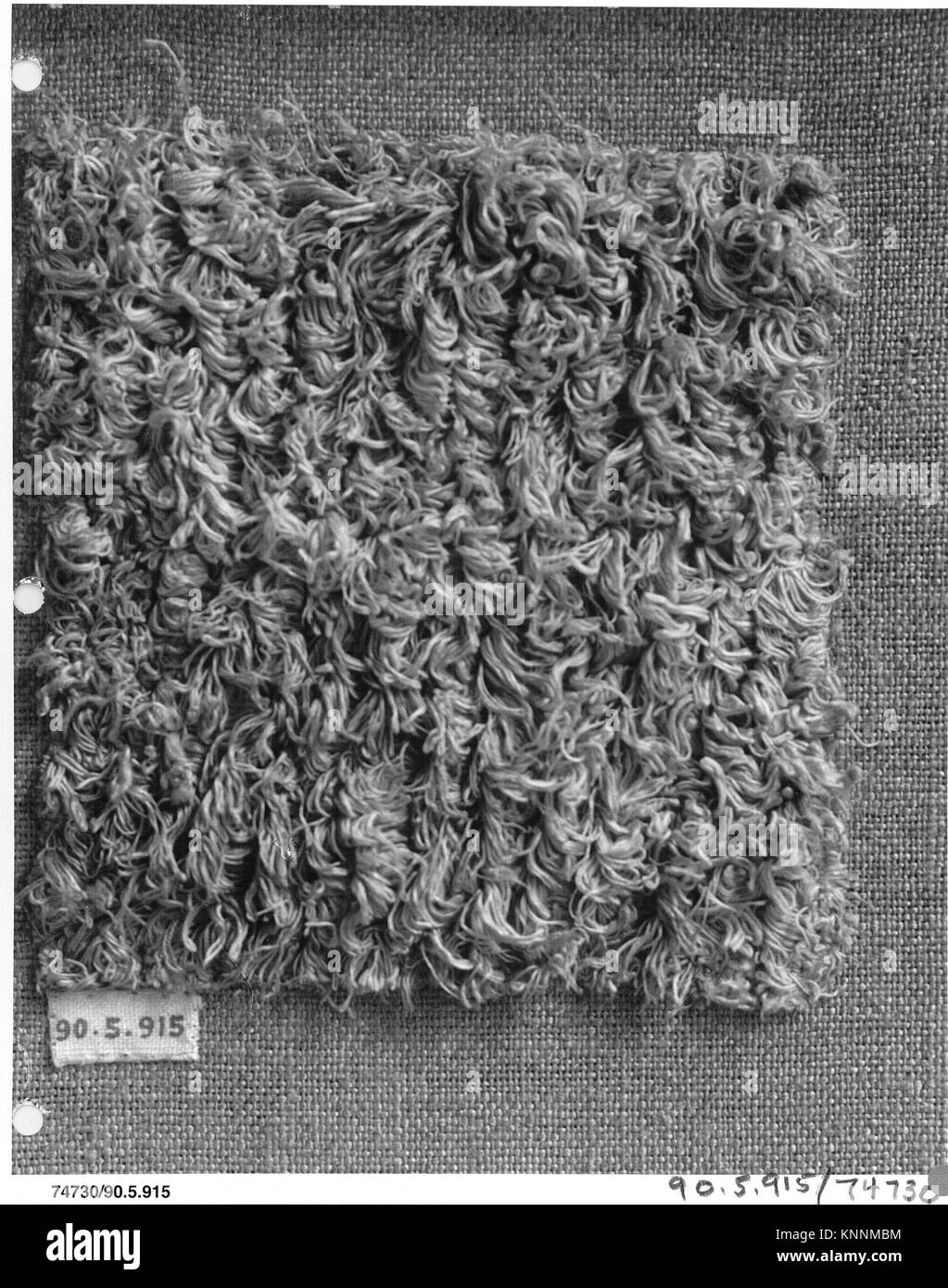 A fragment of a historical object showing preserved material, texture ...