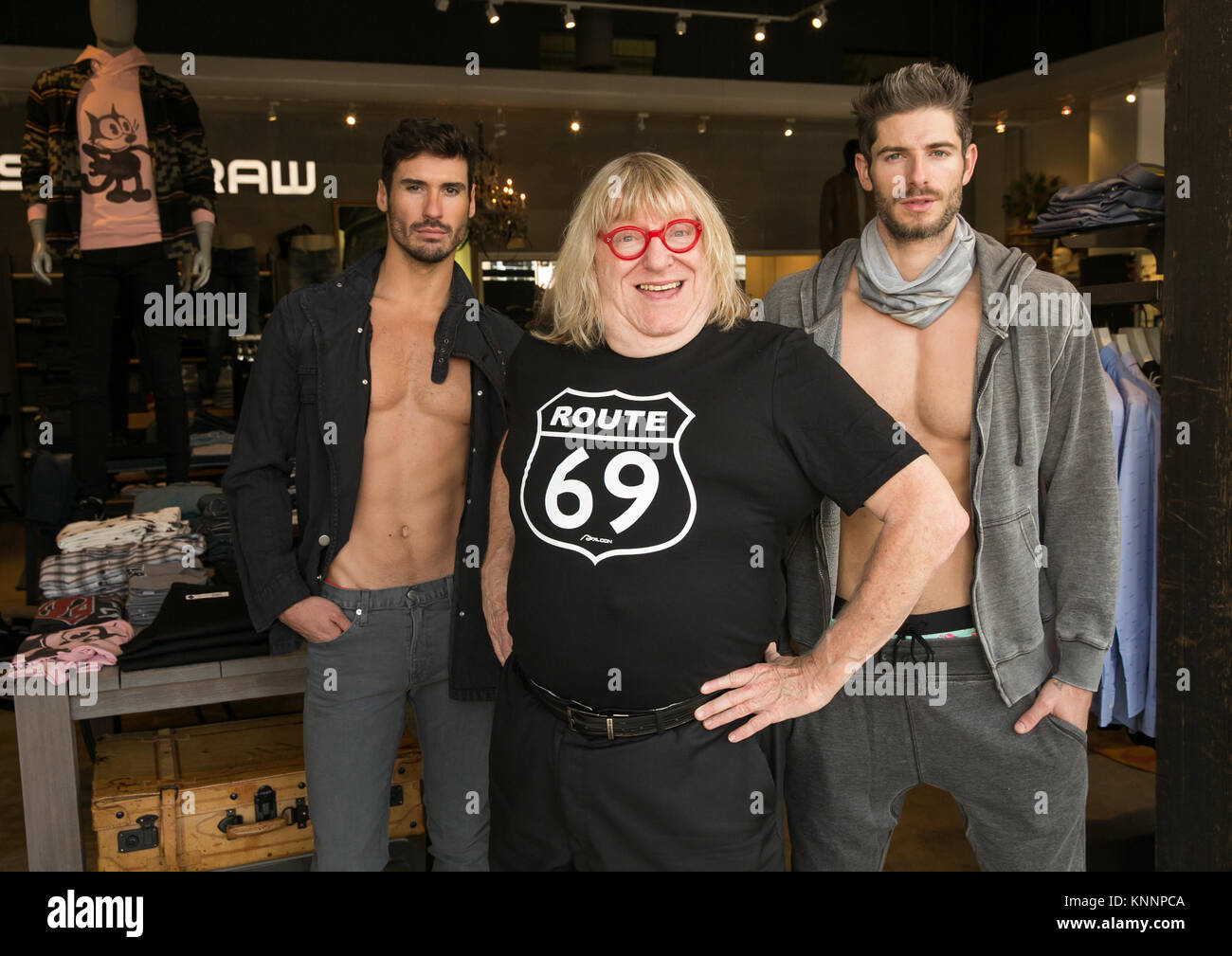 Comedy writer Bruce Vilanch poses at LASC with male models Timo Nunez ...