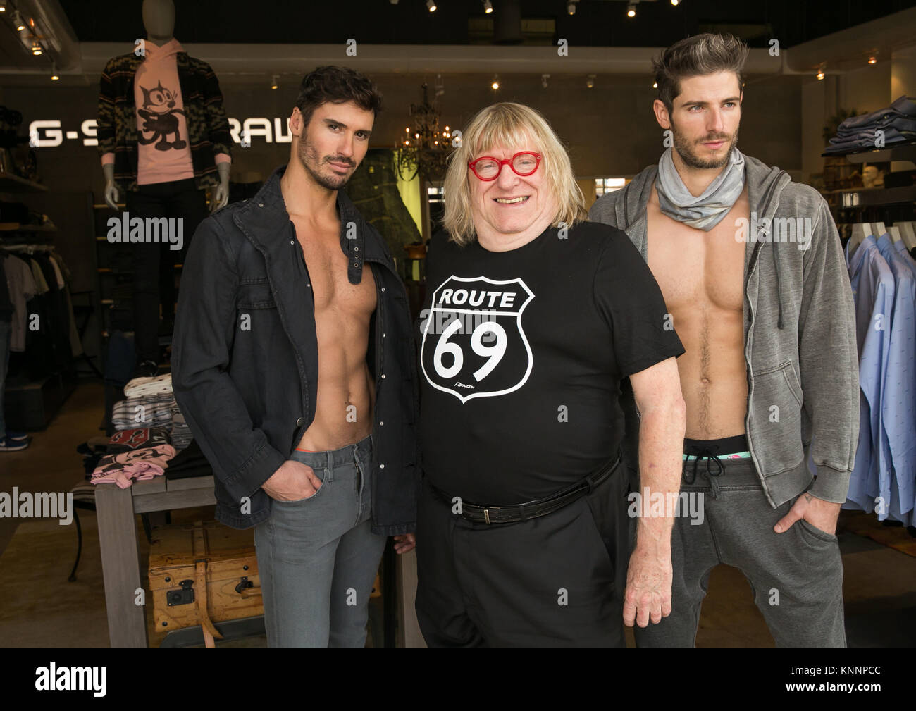 Comedy writer Bruce Vilanch poses at LASC with male models Timo Nunez ...