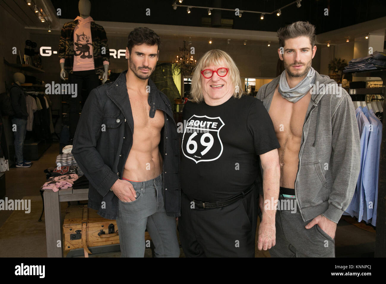 Comedy writer Bruce Vilanch poses at LASC with male models Timo Nunez ...