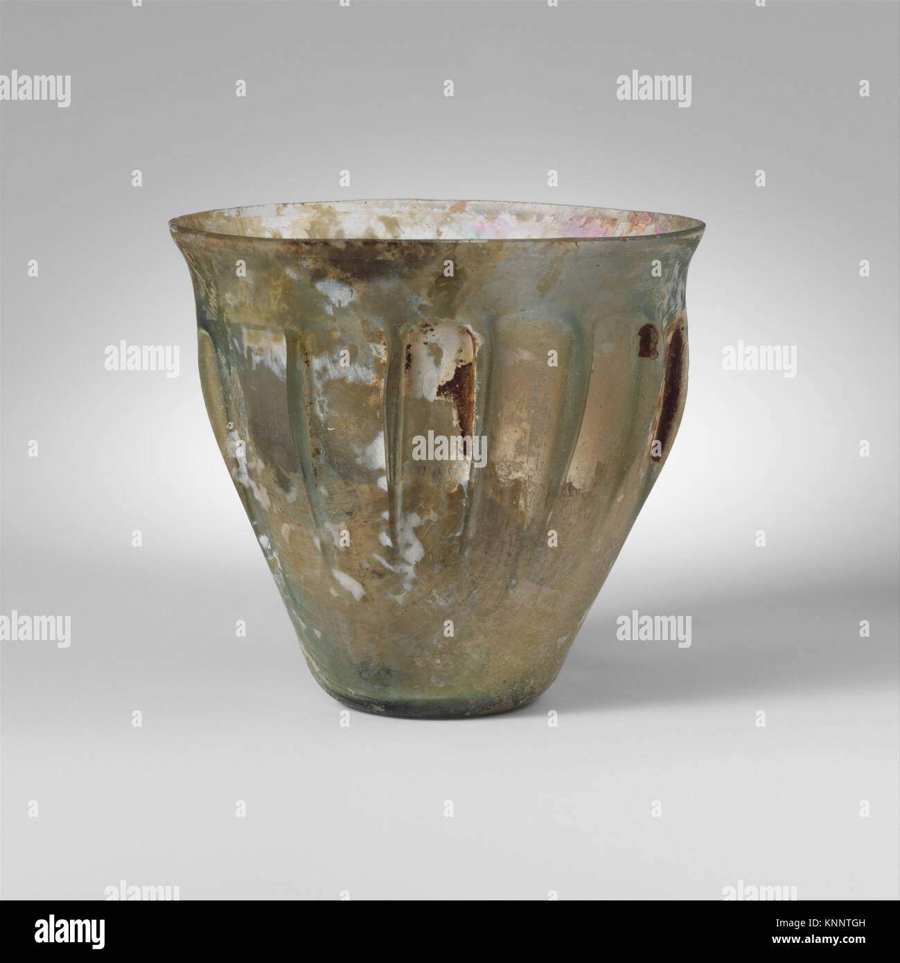 A Roman ribbed glass beaker from the mid-1st century A.D., showcasing ...