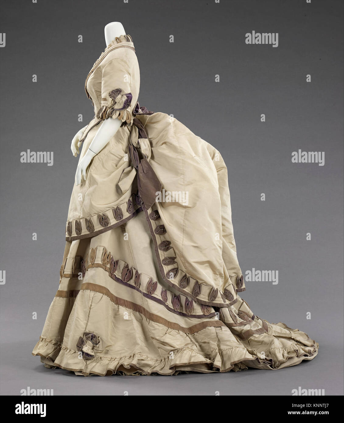 This dinner dress shows the side view, illustrating period-specific ...