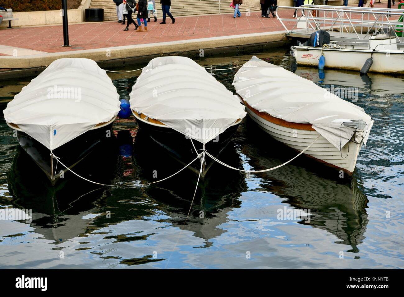 Three row boats covered during winter Stock Photo - Alamy