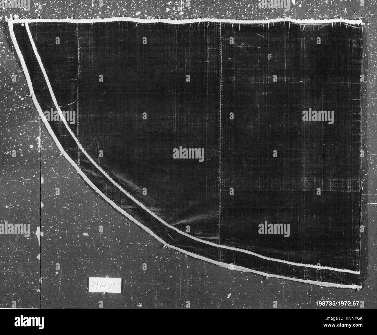 This cope-shape MET 198735 is a textile or garment component showing ...
